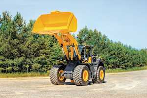 Want a versatile loader with the capacity to load highway trucks ...
